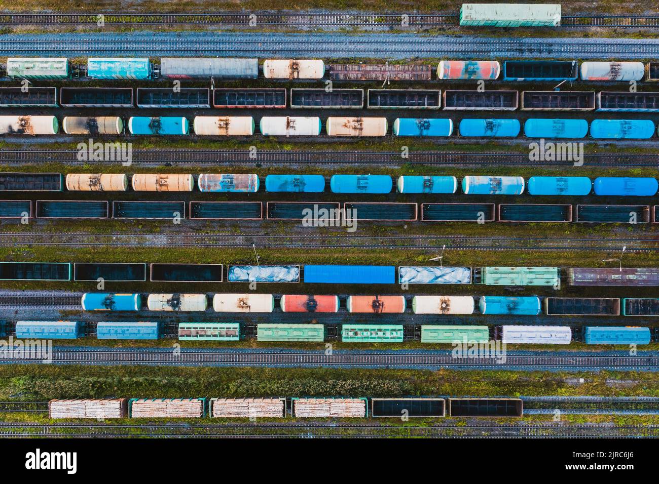 Aerial view of rail sorting freight station with railway carriage, with many rail tracks ...
