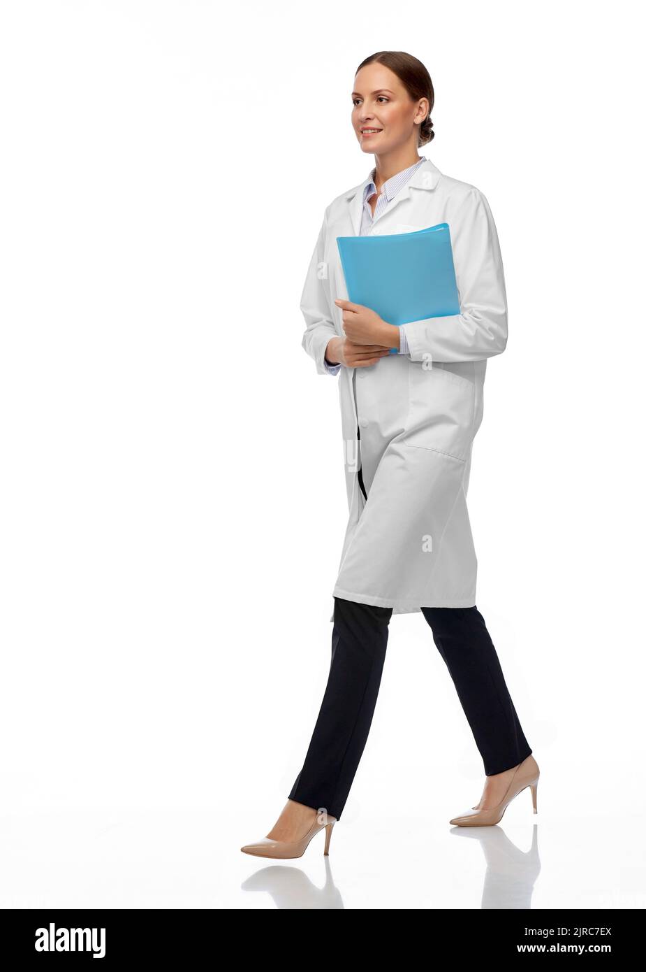 female doctor or scientist walking with folder Stock Photo - Alamy
