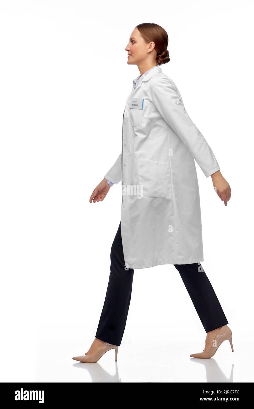 smiling female doctor or scientist walking Stock Photo - Alamy