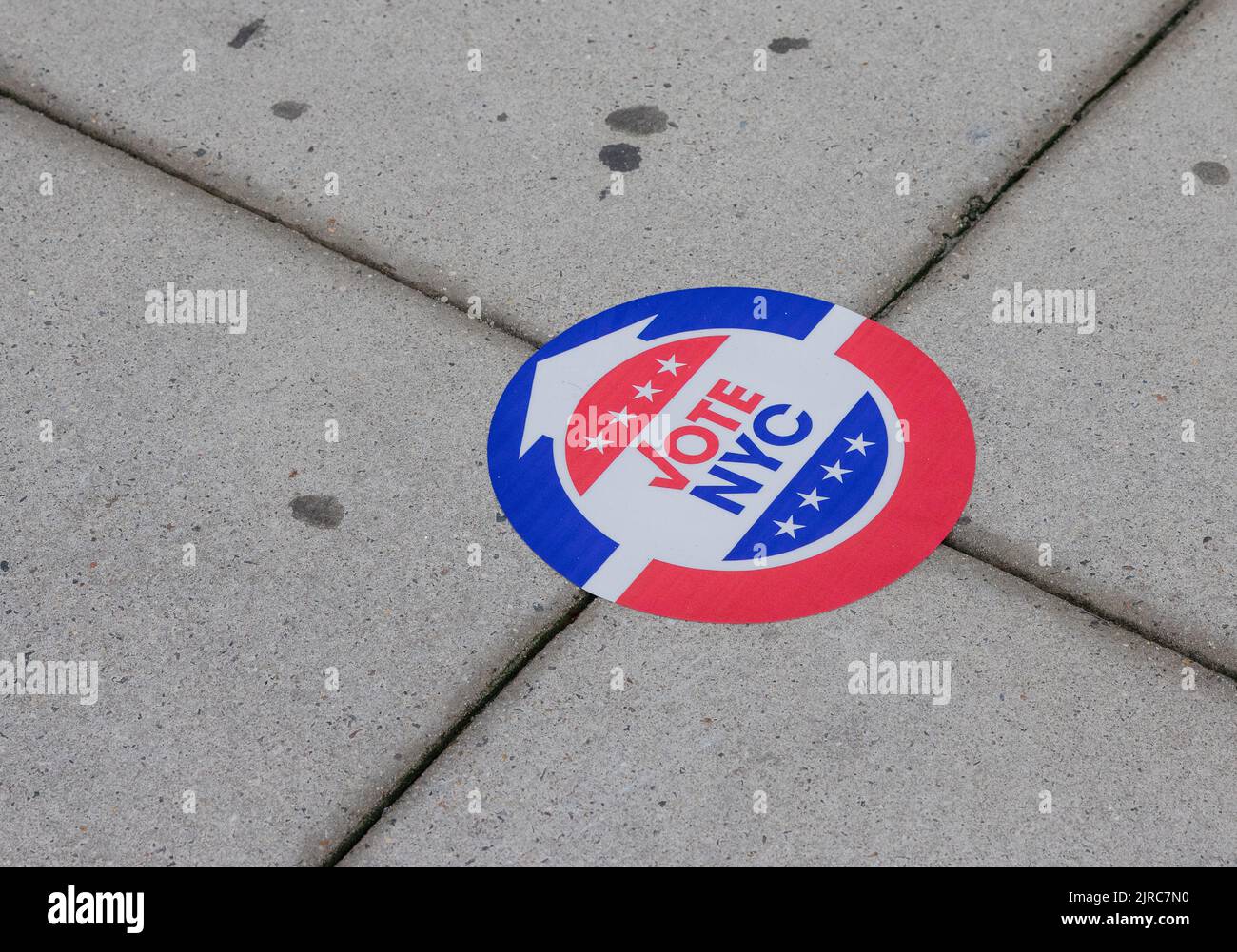 NEW YORK, N.Y. – August 23, 2022: A decal points towards the entrance ...