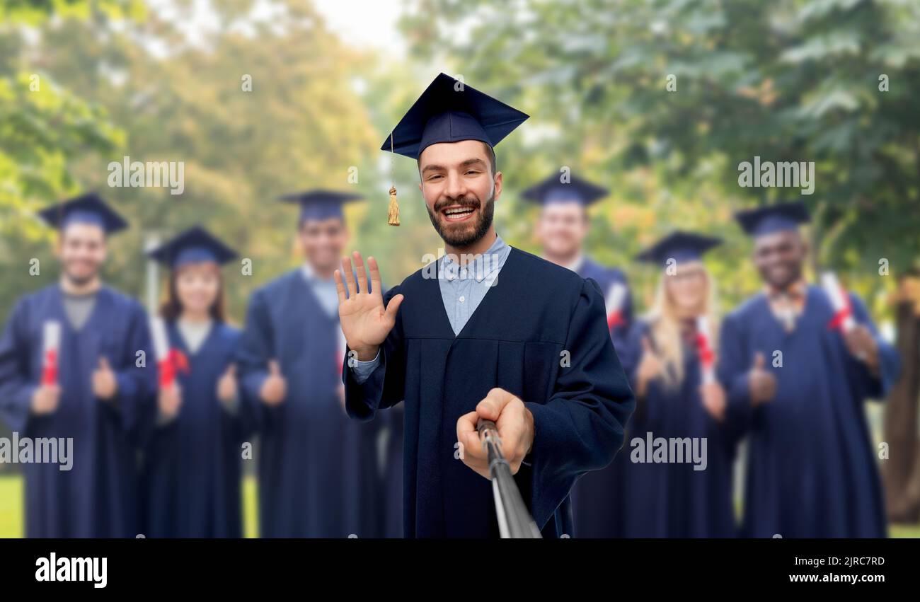 male graduate student taking selfie with monopod Stock Photo - Alamy
