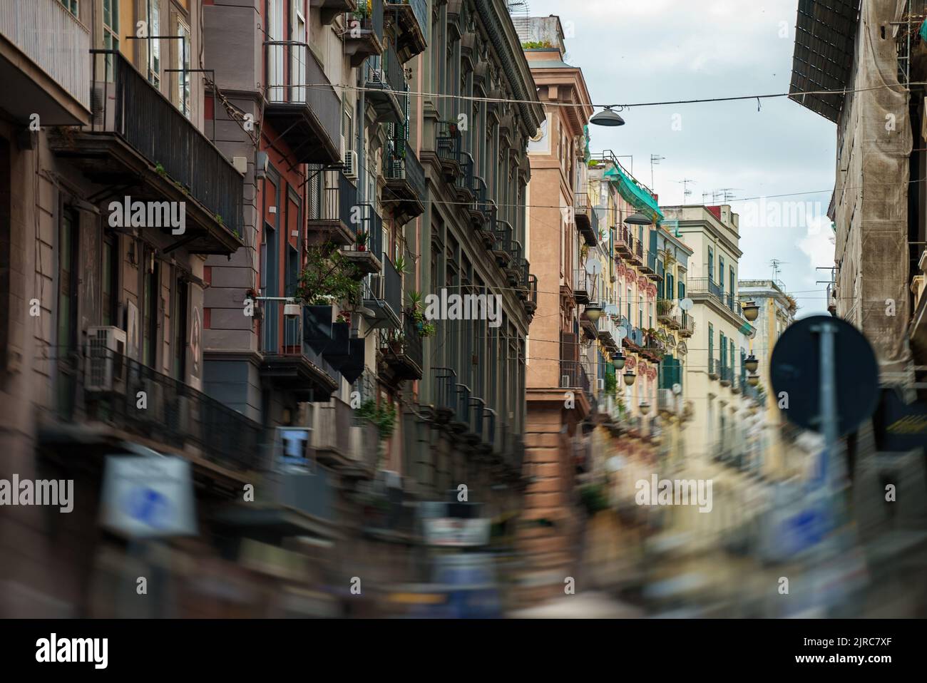 Typical italian street with windows and balconies Stock Photo - Alamy