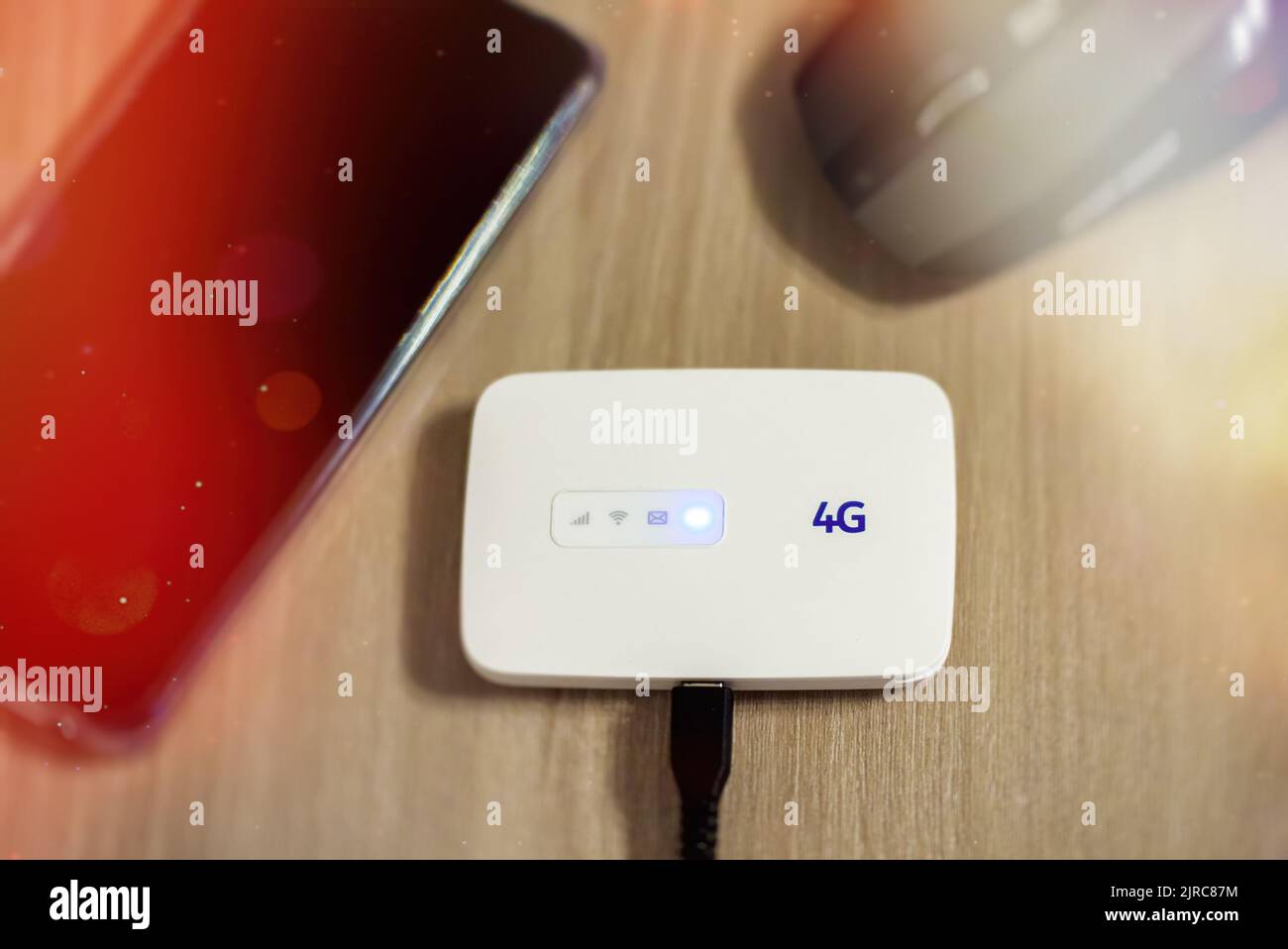 Modern wireless pocket 4g wifi modem Stock Photo - Alamy