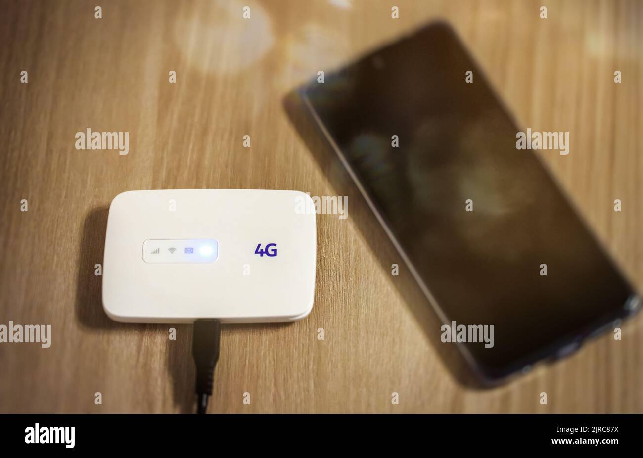 Modern wireless pocket 4g wifi modem Stock Photo - Alamy