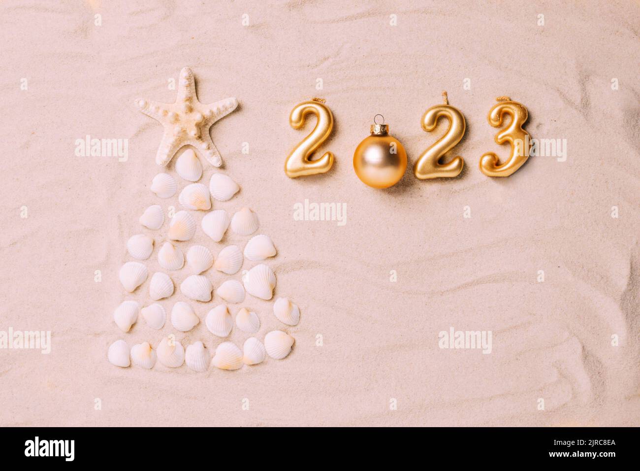 Creative Christmas tree made of shells and symbolic numbers of new year ...