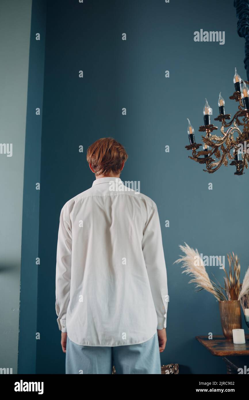 Portrait european young man standing back rear view turned away Stock ...