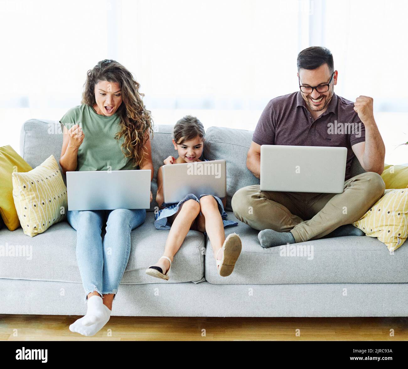 child laptop family computer woman mother father happy home man ...
