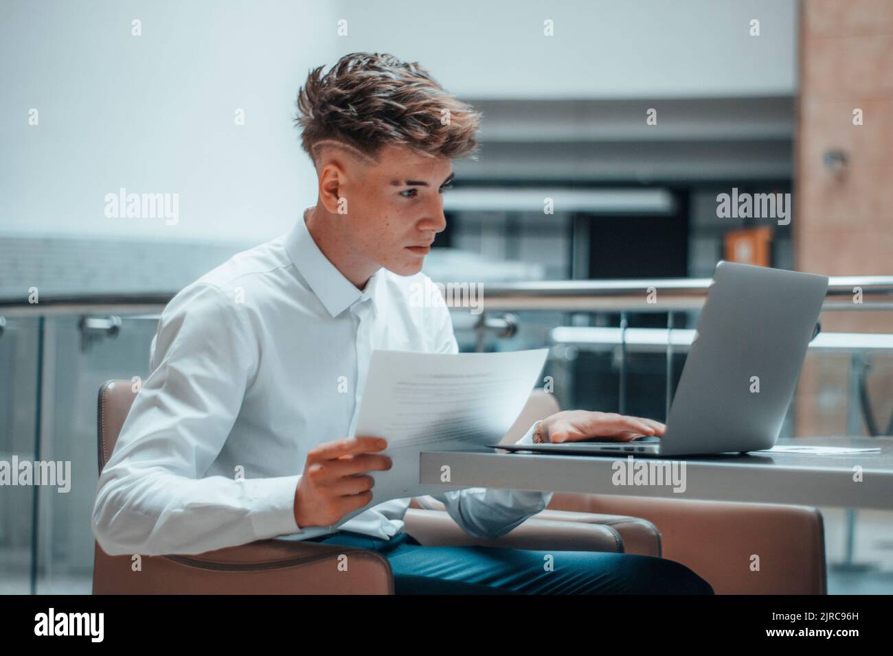 Young spanish man working hi-res stock photography and images - Alamy