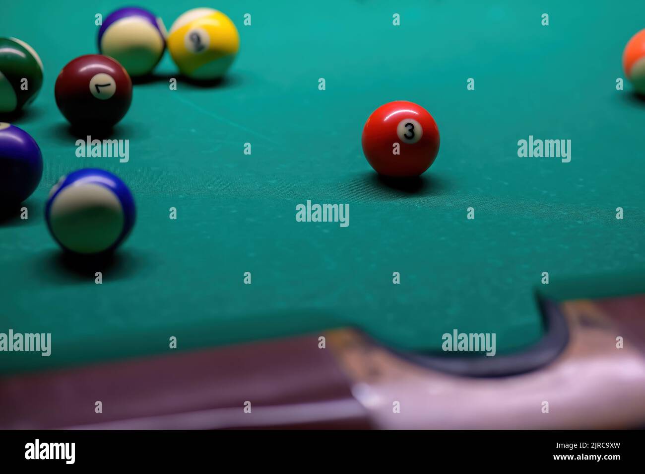 Balls in front of a pocket on a billiard table. American billiards ...