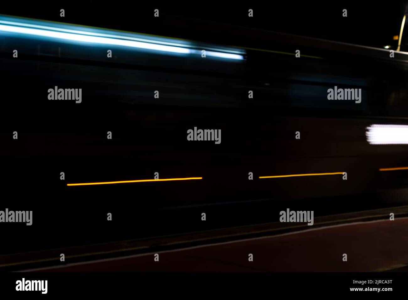 Colorful light trails with motion blur effect of a bus, long time ...