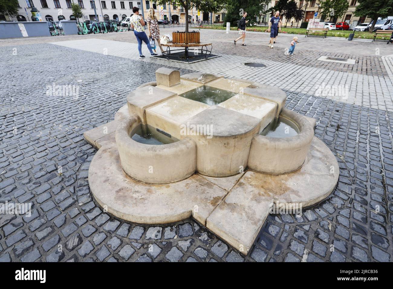 A modern fountain at The Rynek Podgorski in Krakow, Poland Stock Photo ...