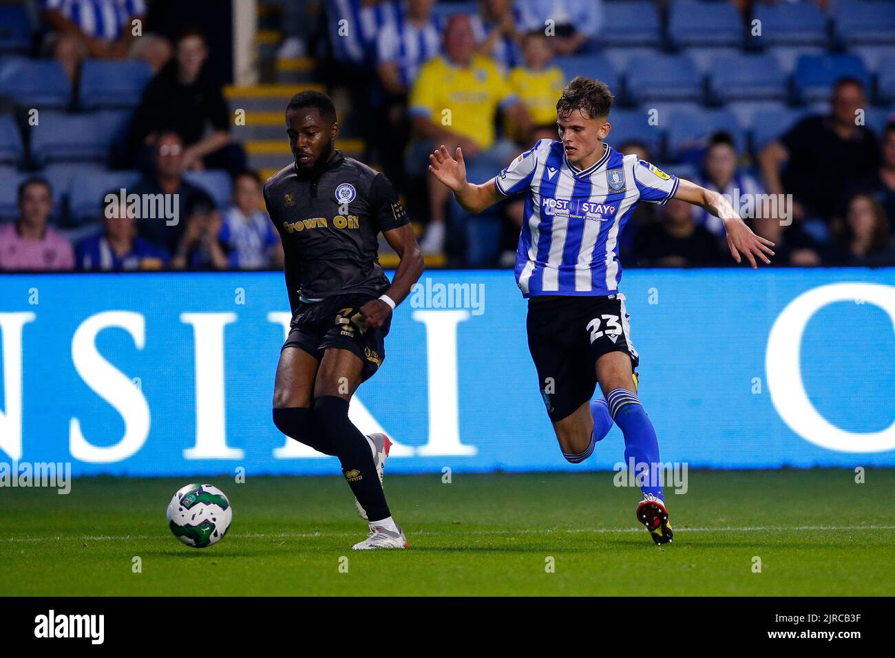 Jay Glover #23 of Sheffield Wednesday and Cameron John #24 of Rochdale ...