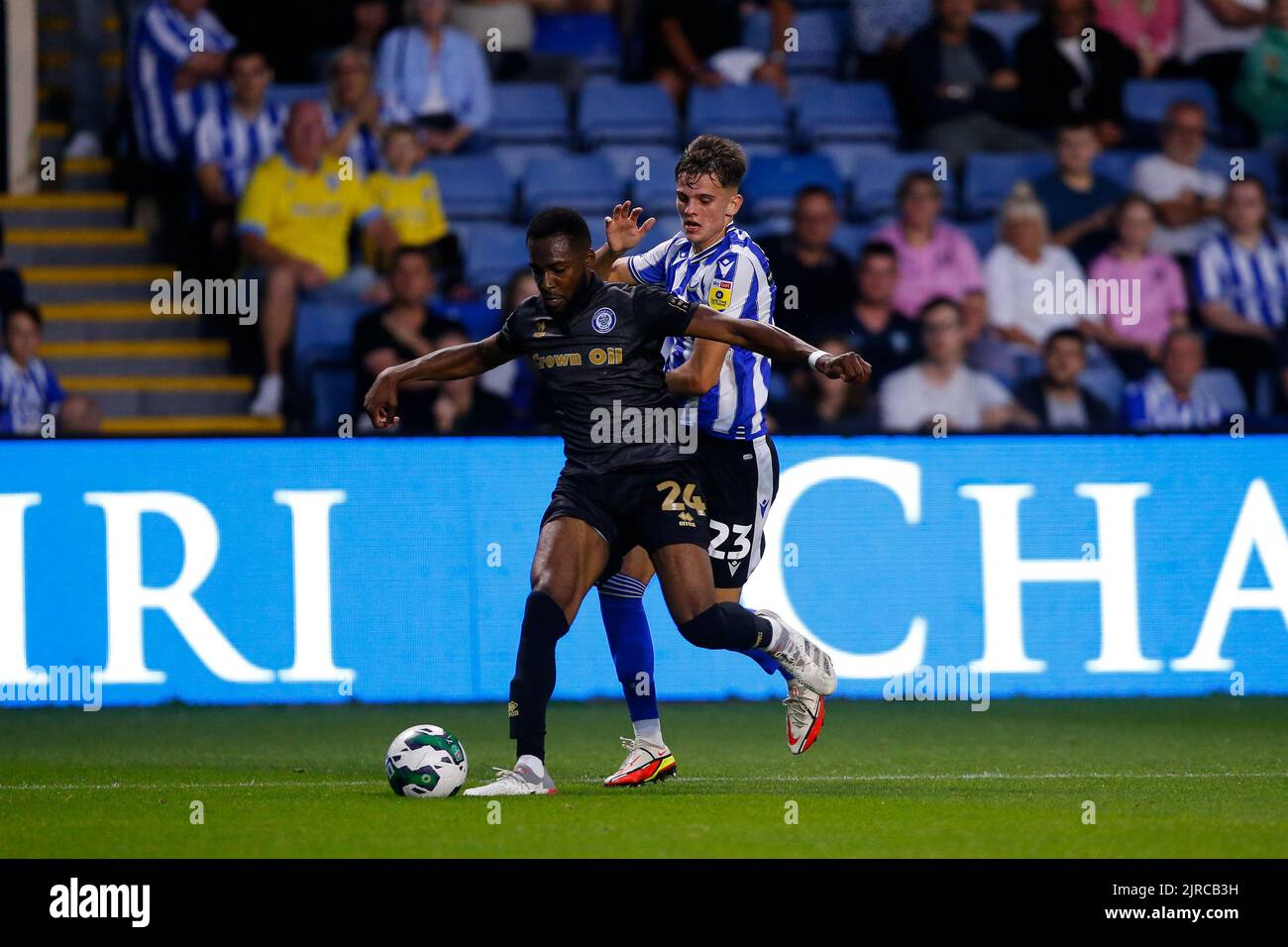 Jay Glover #23 of Sheffield Wednesday and Cameron John #24 of Rochdale ...