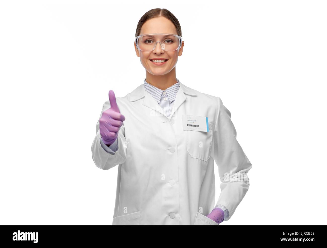 female scientist in goggles showing thumbs up Stock Photo - Alamy