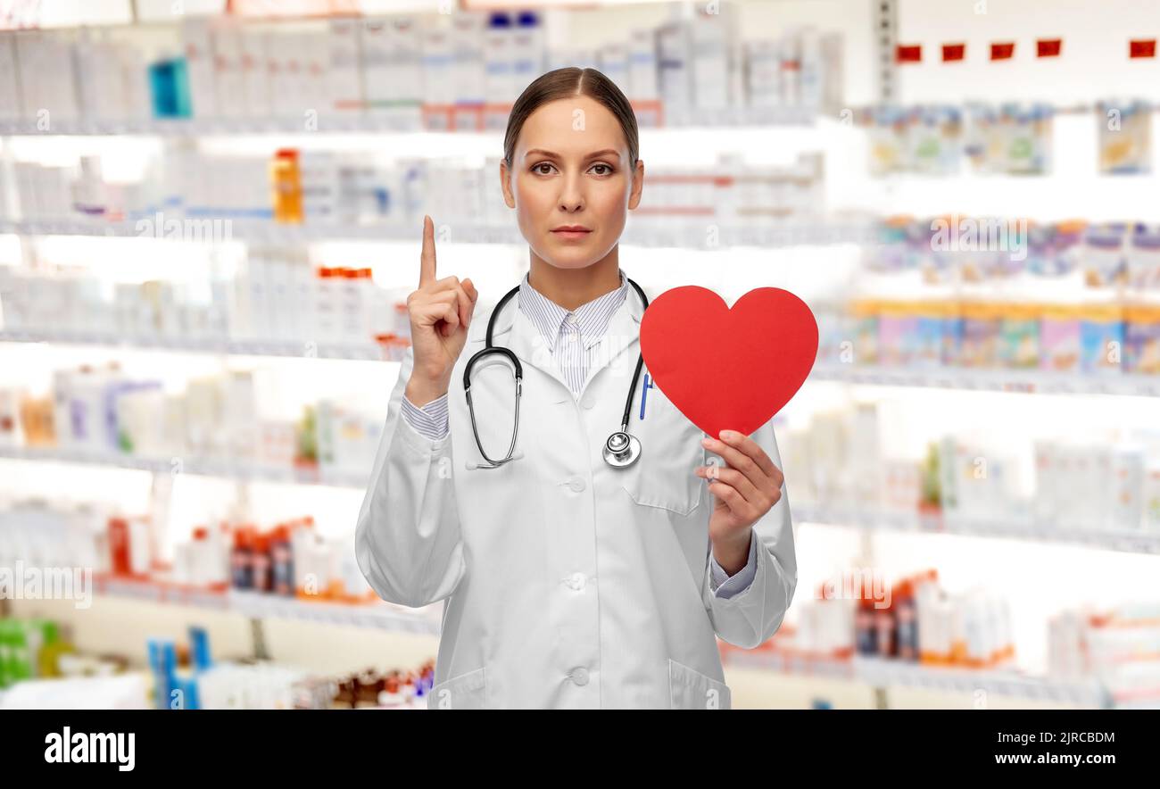 Woman pointing at heart hi-res stock photography and images - Alamy