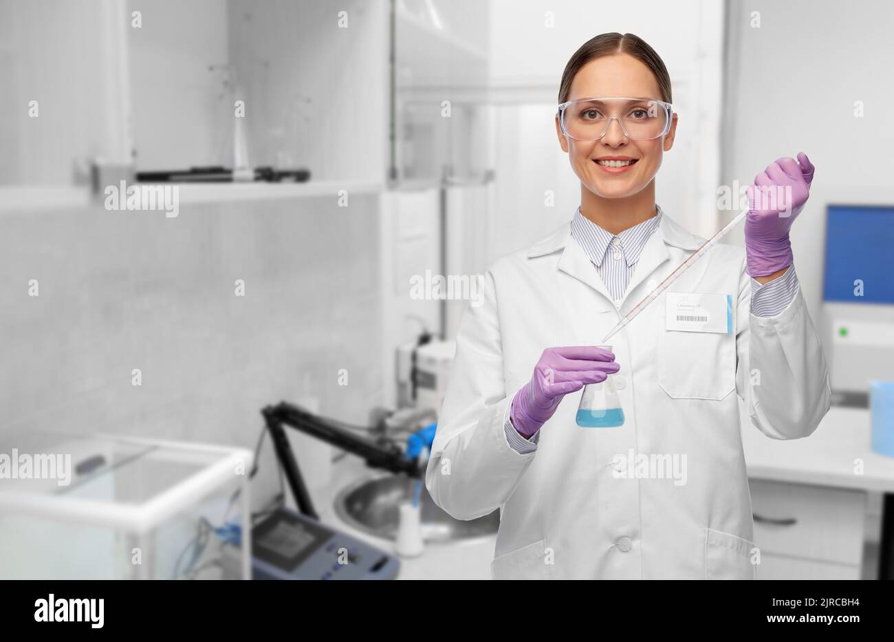 female scientist with chemical at laboratory Stock Photo - Alamy