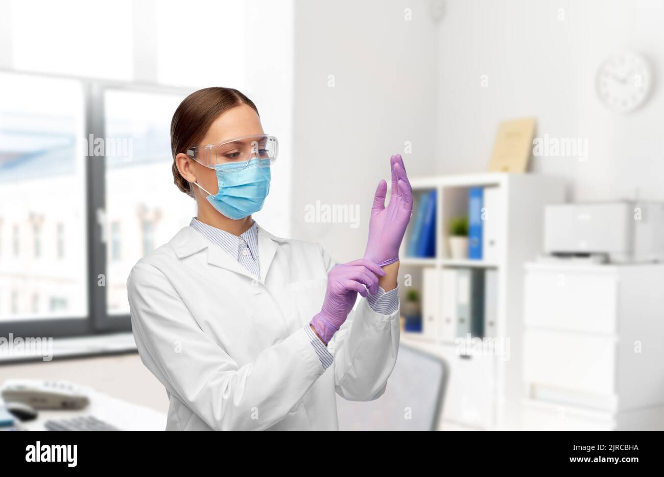 Woman doctor in safety goggles hi-res stock photography and images - Alamy