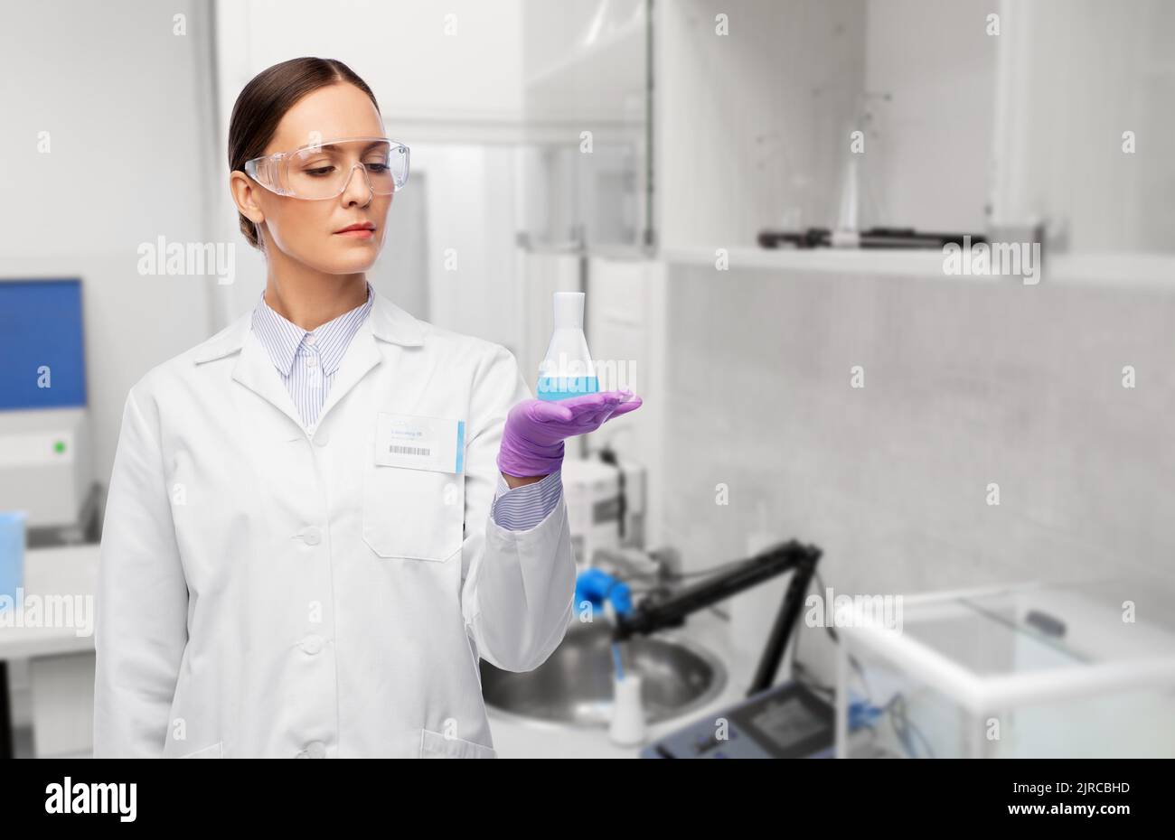 female scientist with chemical at laboratory Stock Photo - Alamy