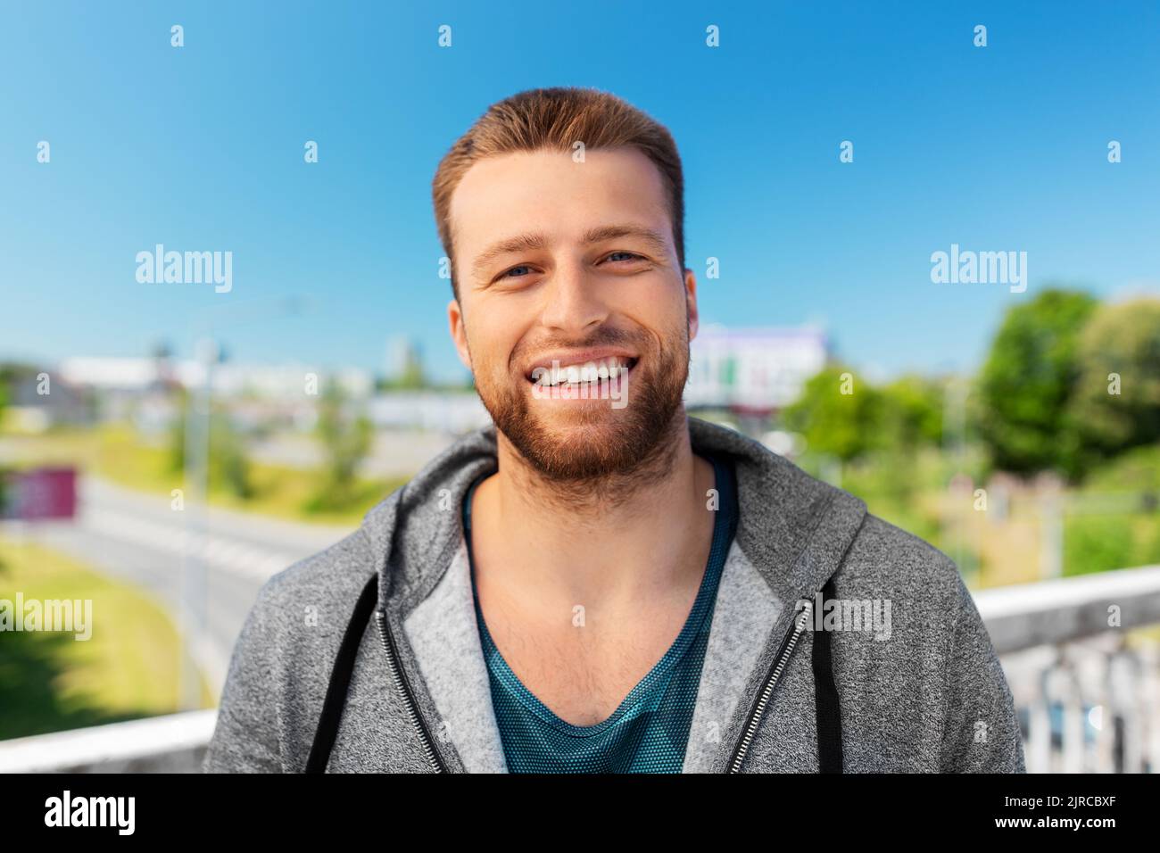 portrait of happy smiling young man outdoors Stock Photo - Alamy
