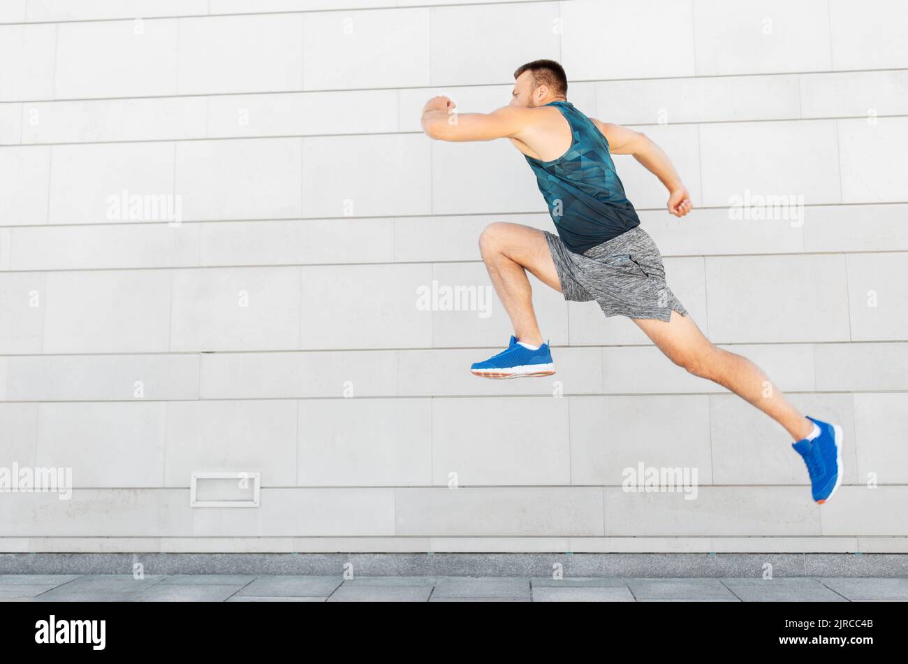 Man running up wall hi-res stock photography and images - Alamy