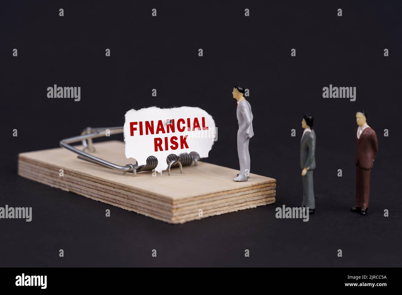 Business trap, crisis concept. Figures of businessmen stand near a ...