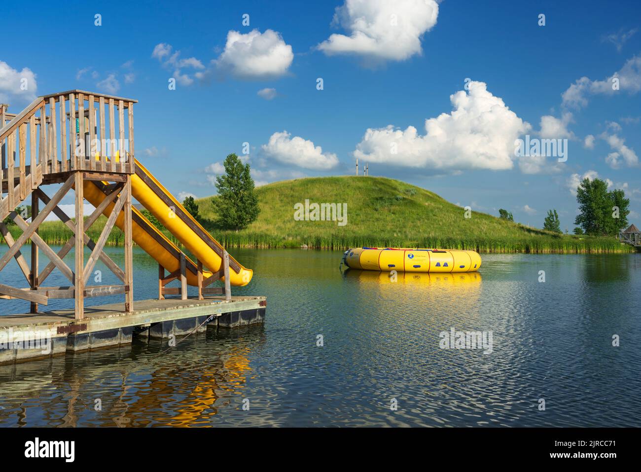 A calm lake with reflections at the Winkler Bible Camp, Winkler ...