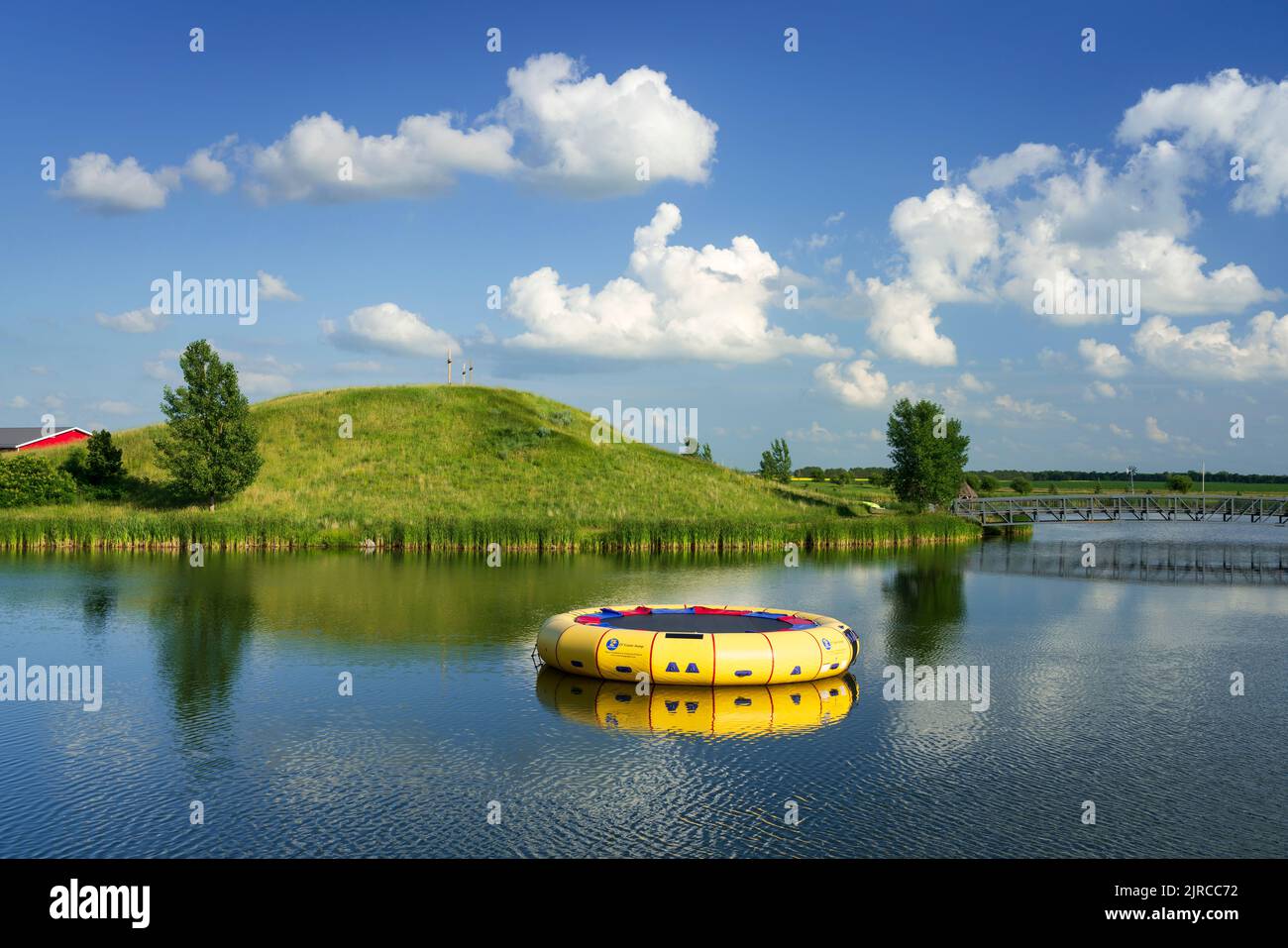 A calm lake with reflections at the Winkler Bible Camp, Winkler ...