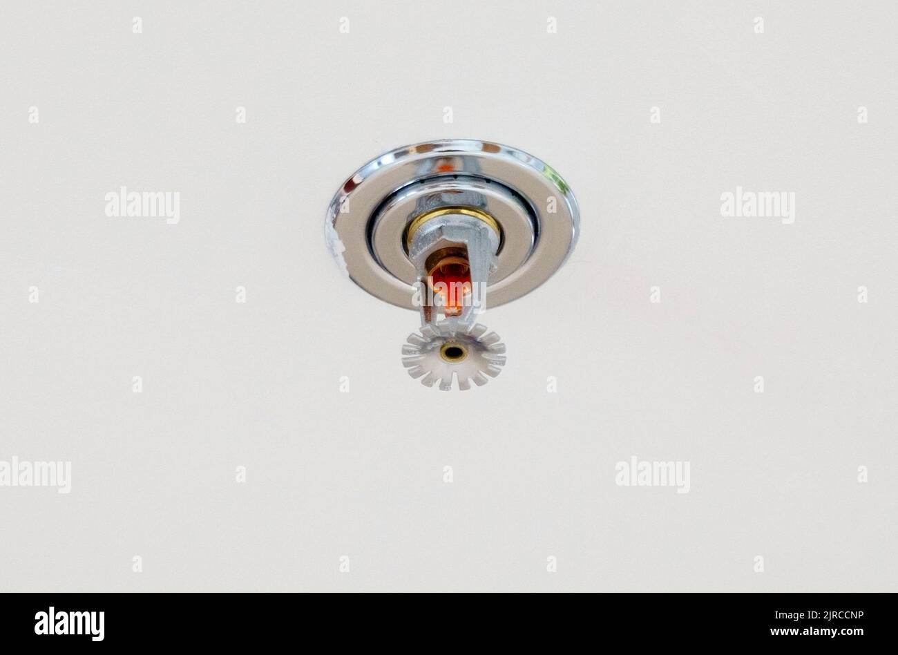 Sprinkler fire extinguishing system close-up on the ceiling in the room ...