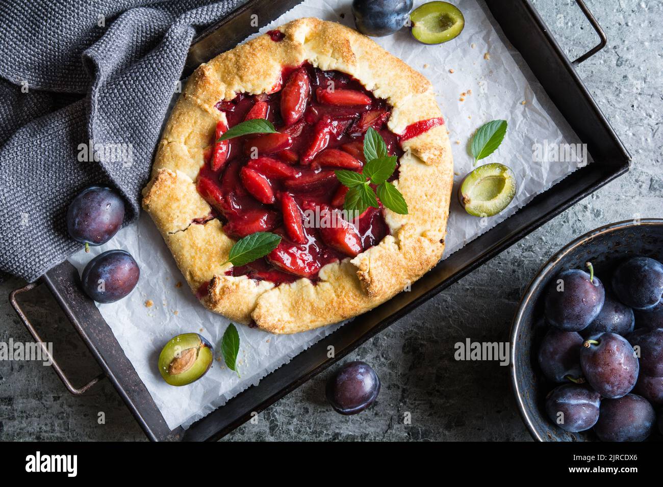 Traditional juicy French Galette pie filled with plums Stock Photo - Alamy