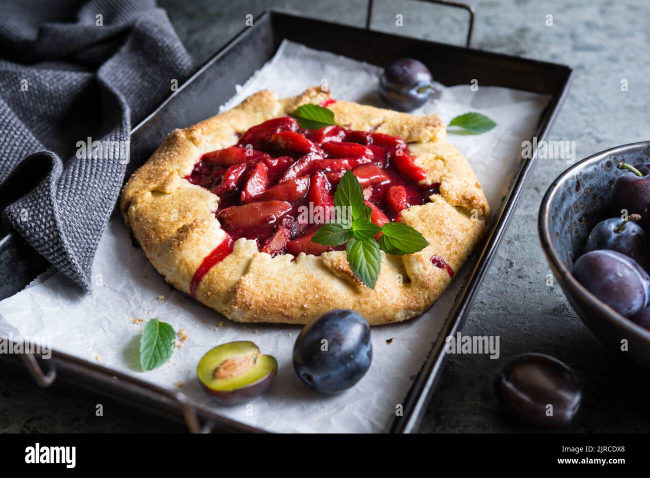 Traditional juicy French Galette pie filled with plums Stock Photo - Alamy