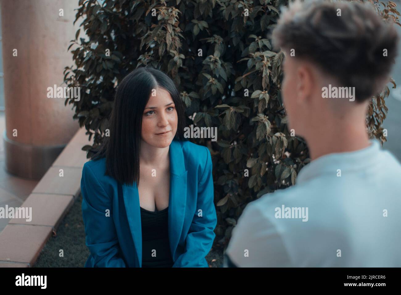 A Caucasian Young girl and a guy staring at each other Stock Photo - Alamy