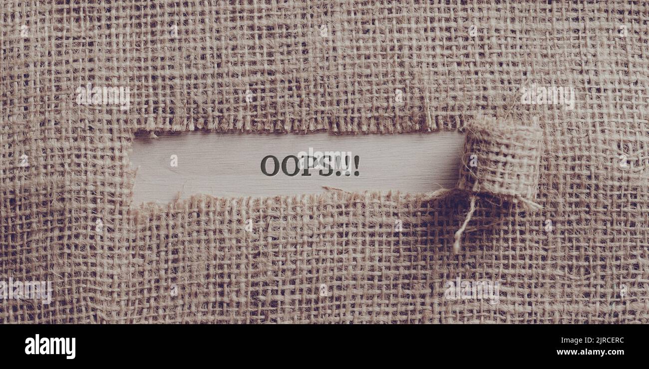 Retro vintage image of a rough linen fabric with a torn window in the ...