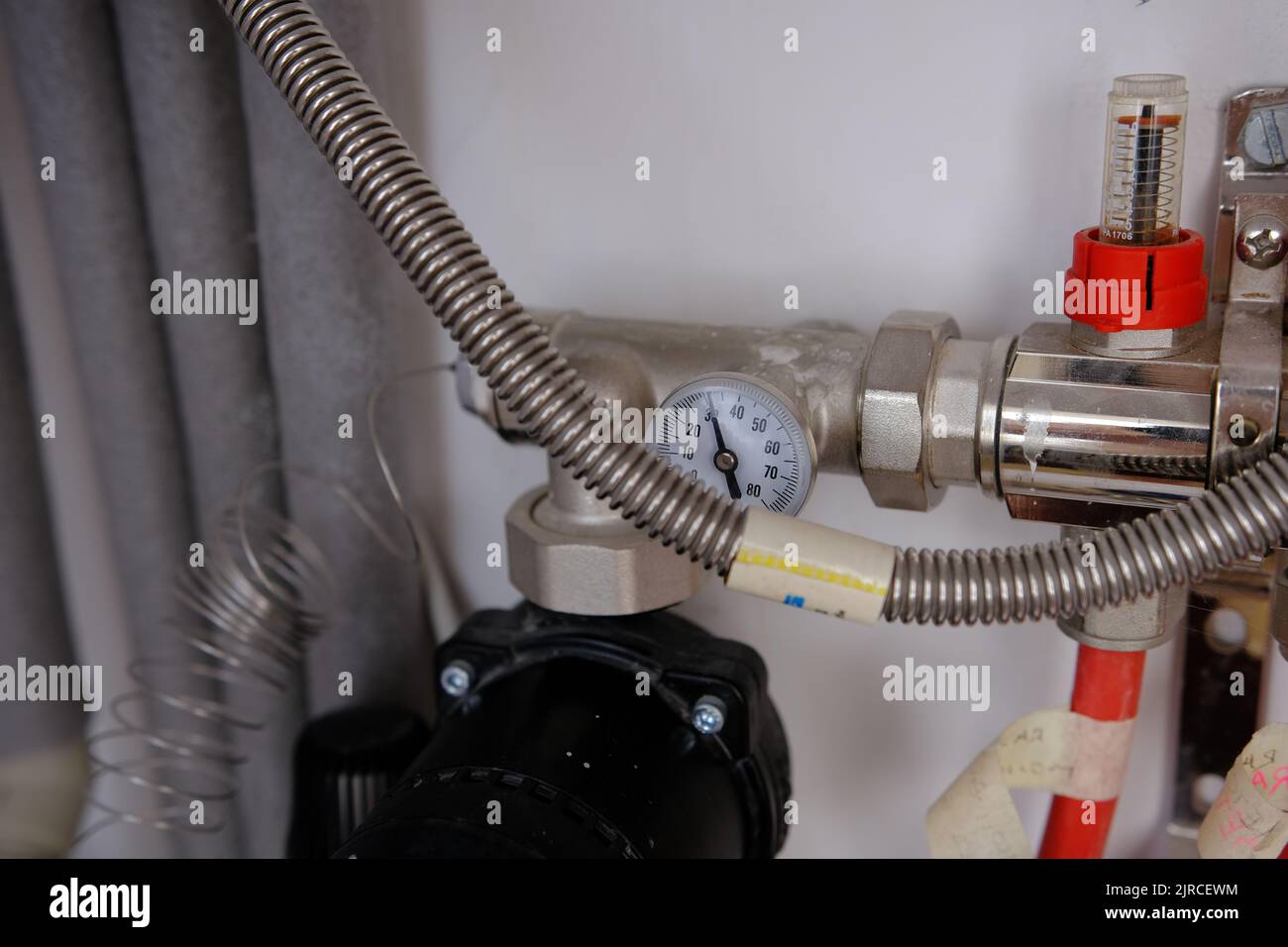 Heating system manifold valves for heat flooring and water supply in a ...