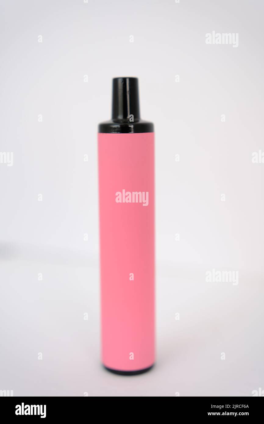 pink disposable electronic cigarette on white background. Copy space ...
