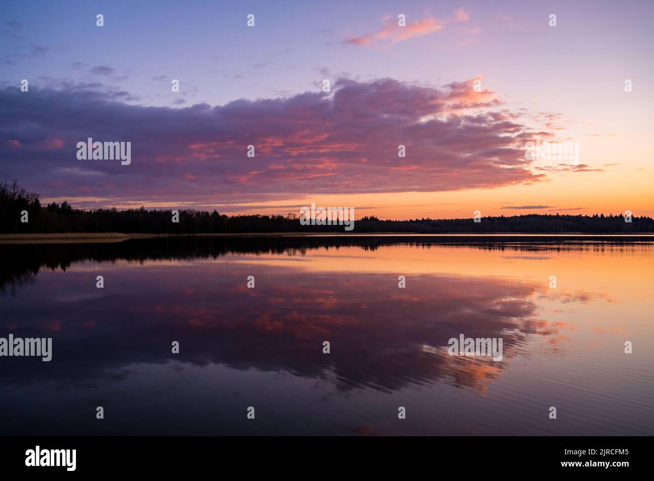 lake in spring at sunset Stock Photo - Alamy
