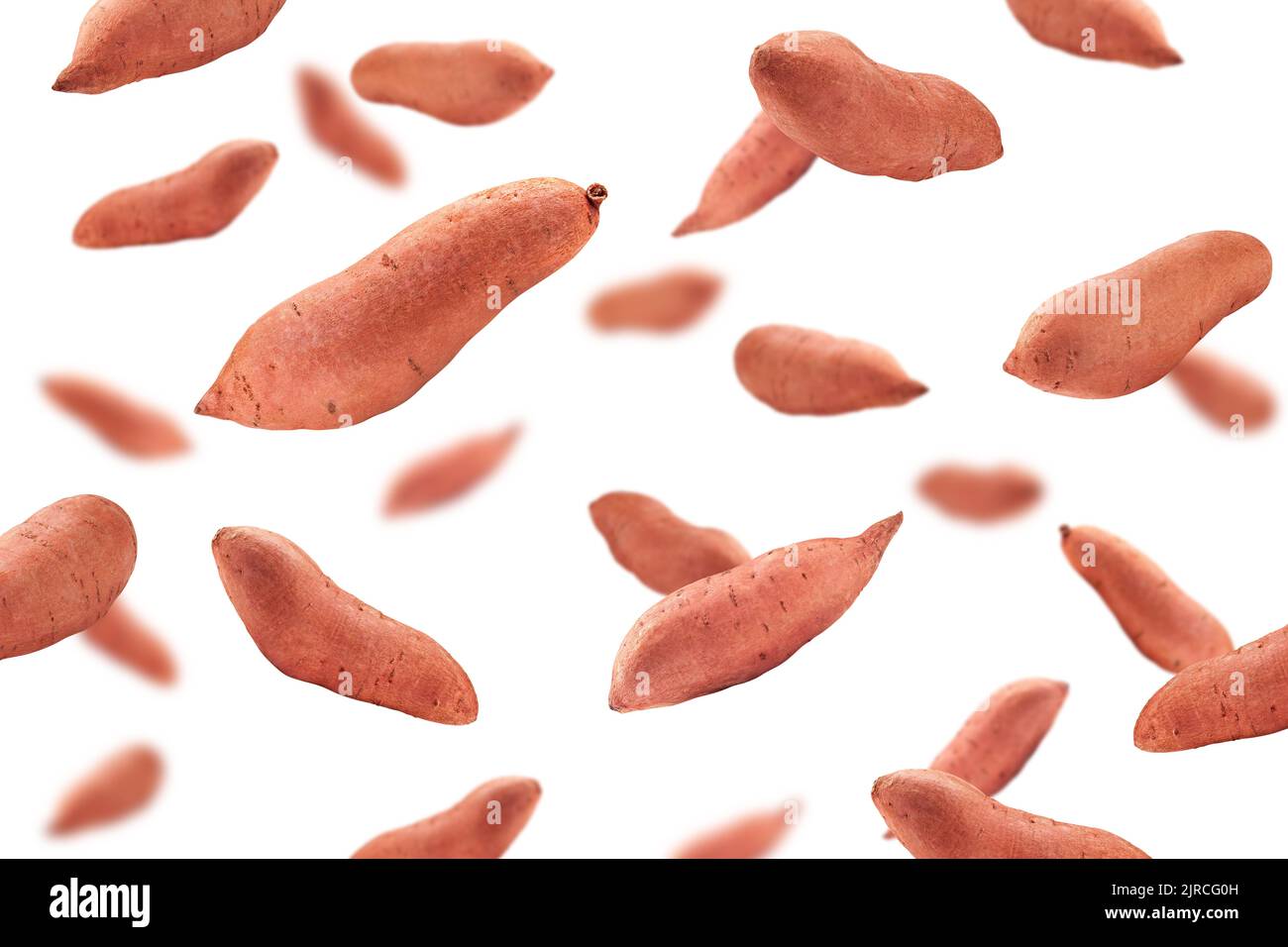 Falling sweet potato, yam, isolated on white background, selective ...