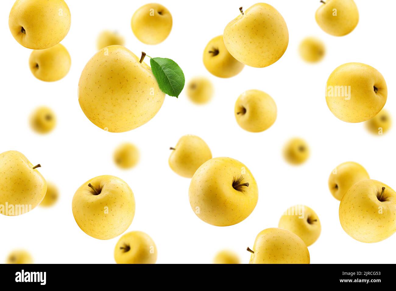 Falling yellow apple isolated on white background, selective focus ...