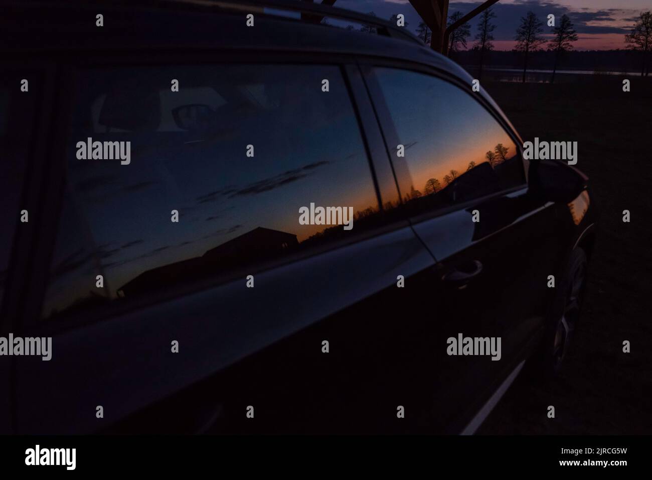 sunset reflecting from car windows Stock Photo - Alamy