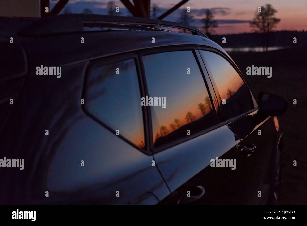 sunset reflecting from car windows Stock Photo - Alamy