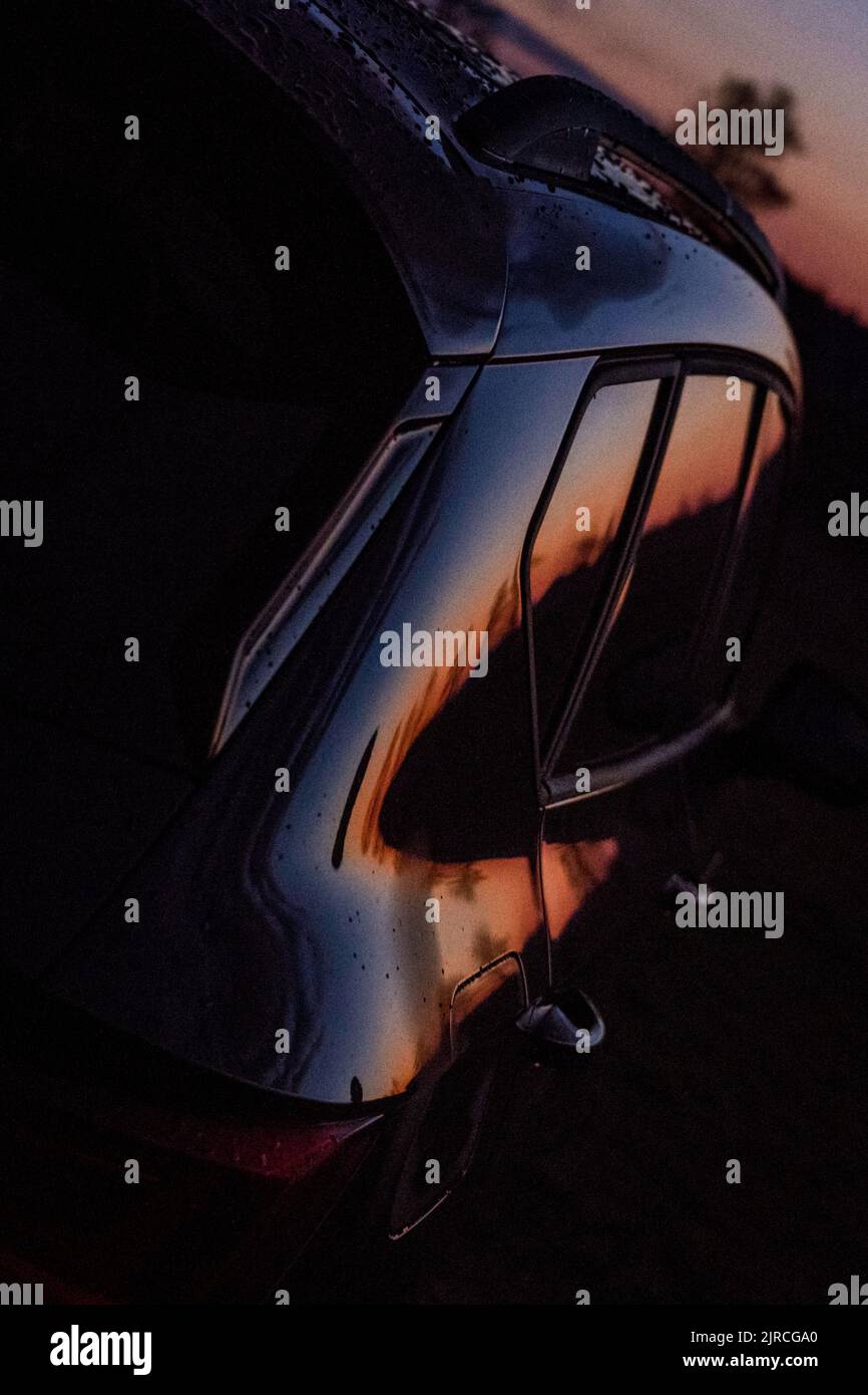 sunset reflecting from car windows Stock Photo - Alamy