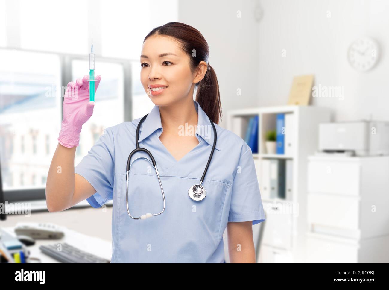 happy asian female nurse with syringe at hospital Stock Photo - Alamy