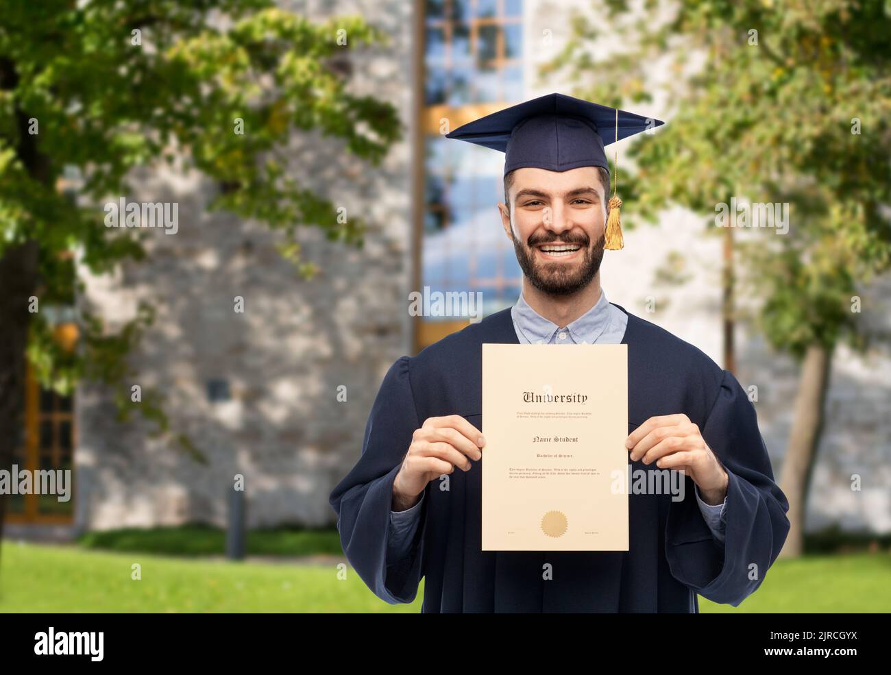 male graduate student in mortar board with diploma Stock Photo - Alamy