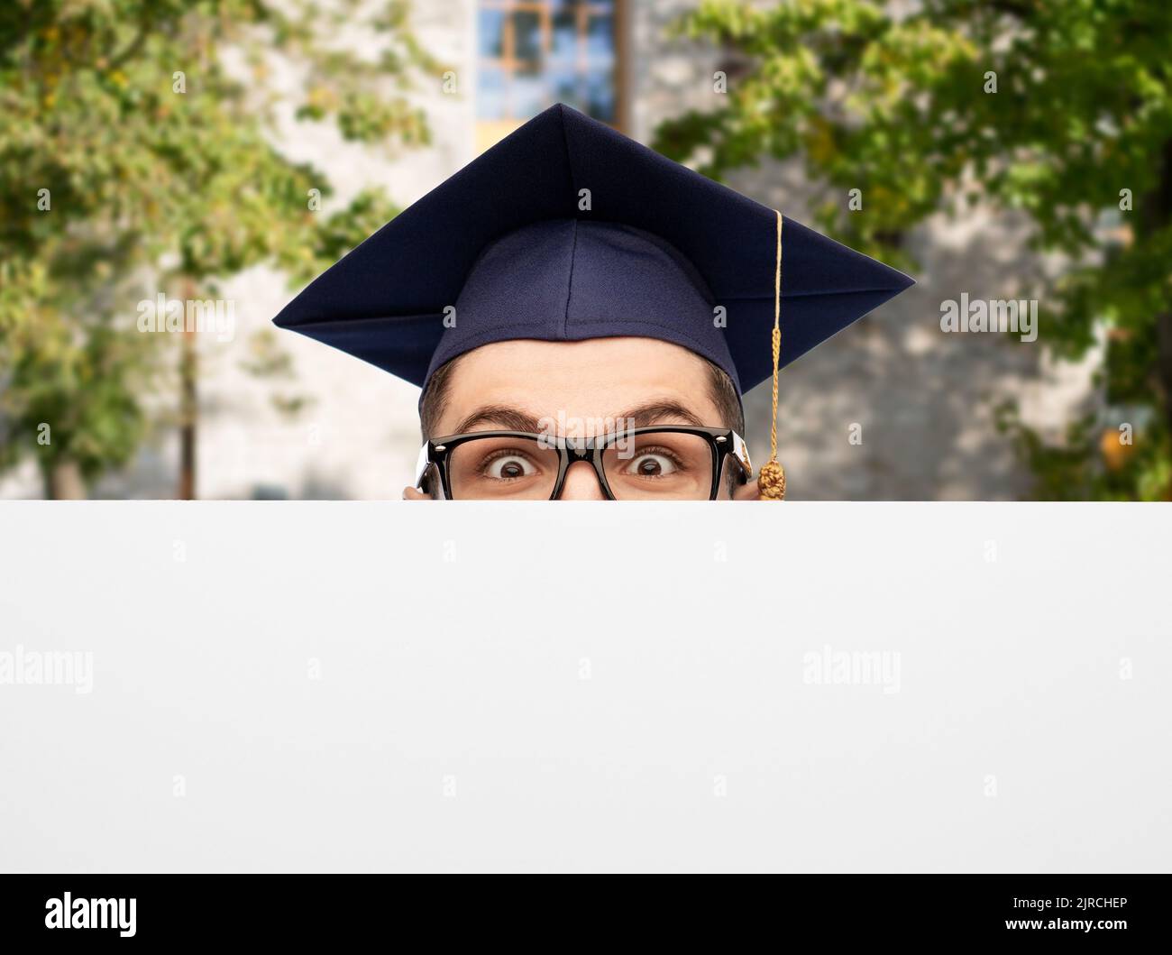 graduate student or bachelor behind white board Stock Photo - Alamy