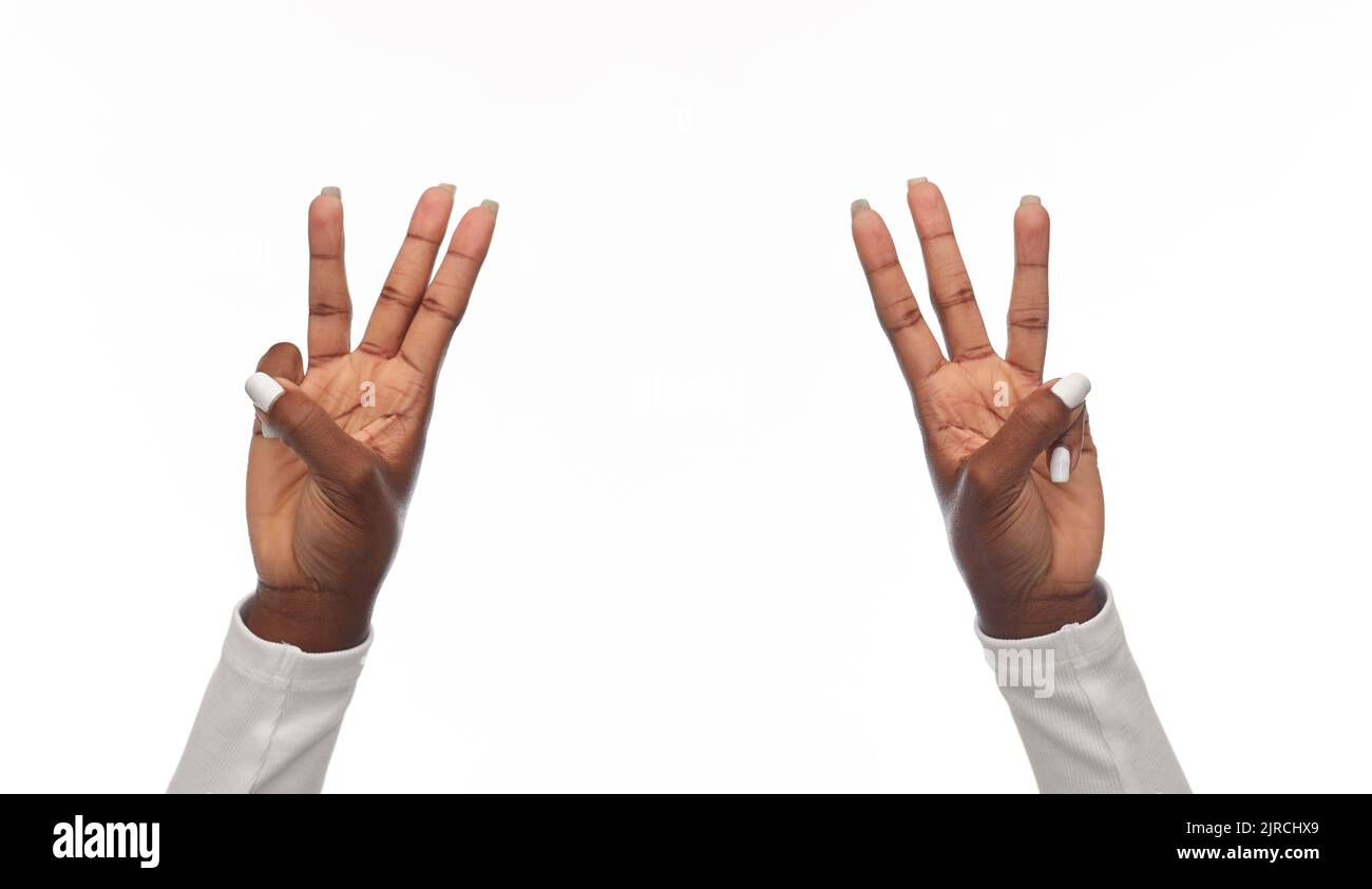 african american woman showing six fingers Stock Photo - Alamy