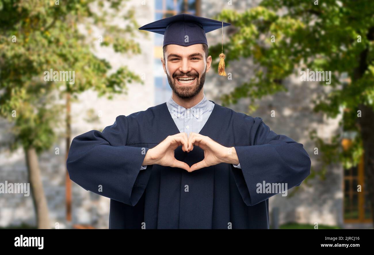 graduate student or bachelor showing hand heart Stock Photo - Alamy