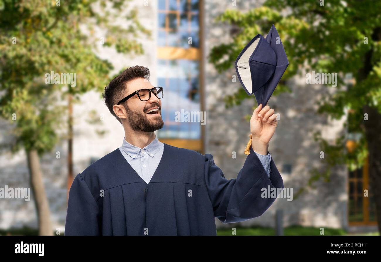 graduate student in bachelor gown with mortarboard Stock Photo - Alamy