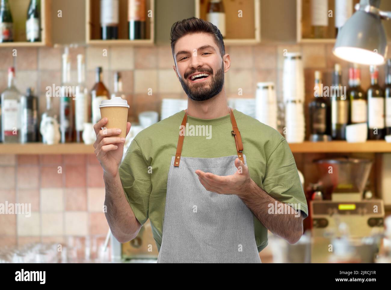 happy smiling barman in apron with takeaway coffee Stock Photo - Alamy