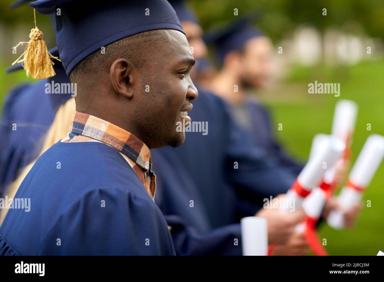 graduate students in mortar boards with diplomas Stock Photo - Alamy