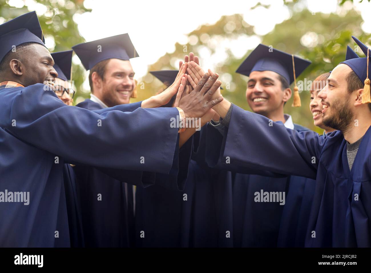 international graduate students making high five Stock Photo - Alamy