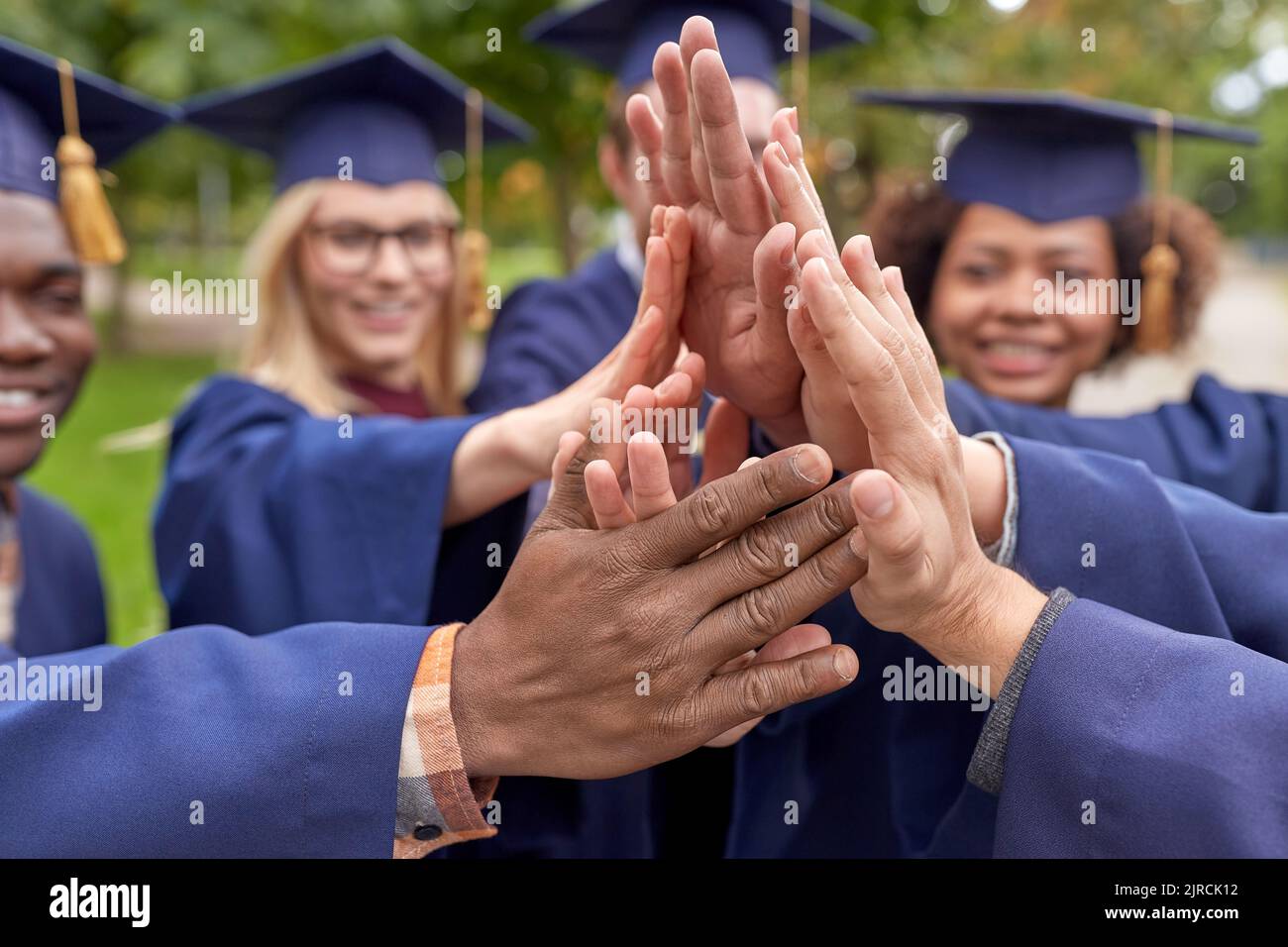 international graduate students making high five Stock Photo - Alamy